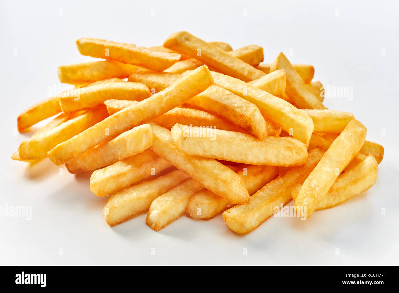 Heap of long french fries on white background Stock Photo - Alamy
