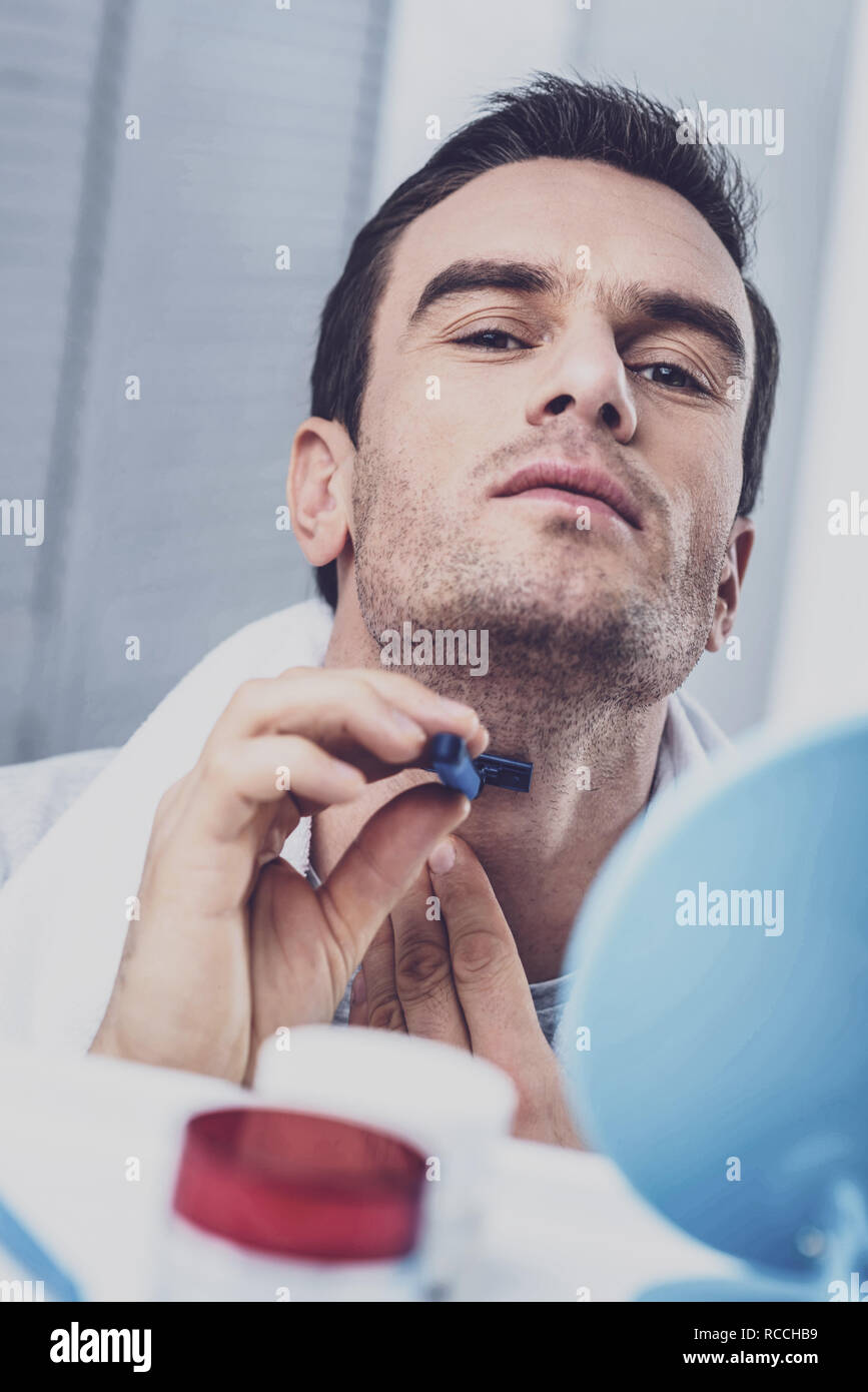 Handsome brunette looking straight at camera Stock Photo - Alamy