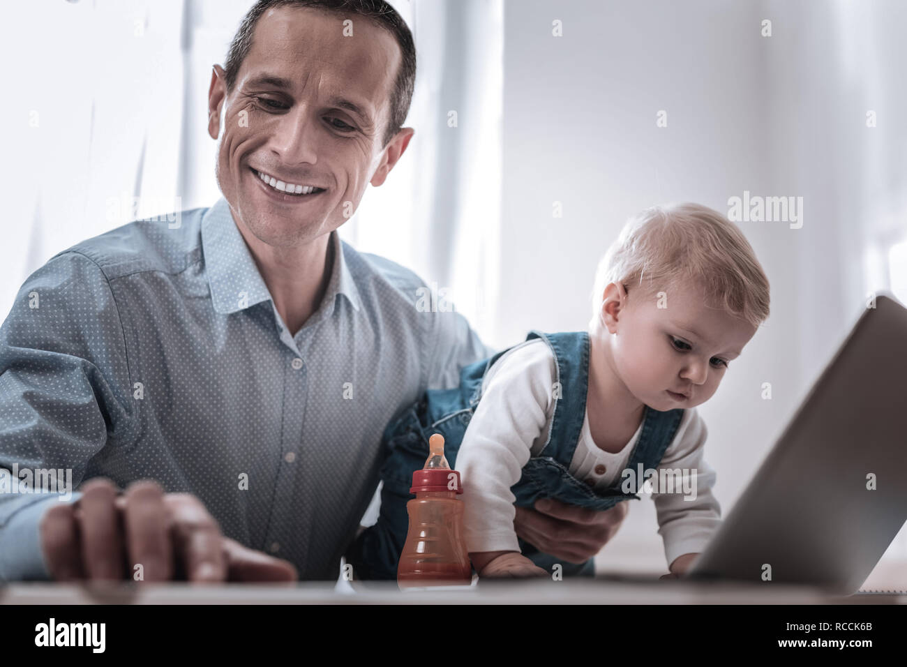 Cheerful positive man smiling Stock Photo - Alamy Cheerful positive man smiling Stock Photo - Alamy