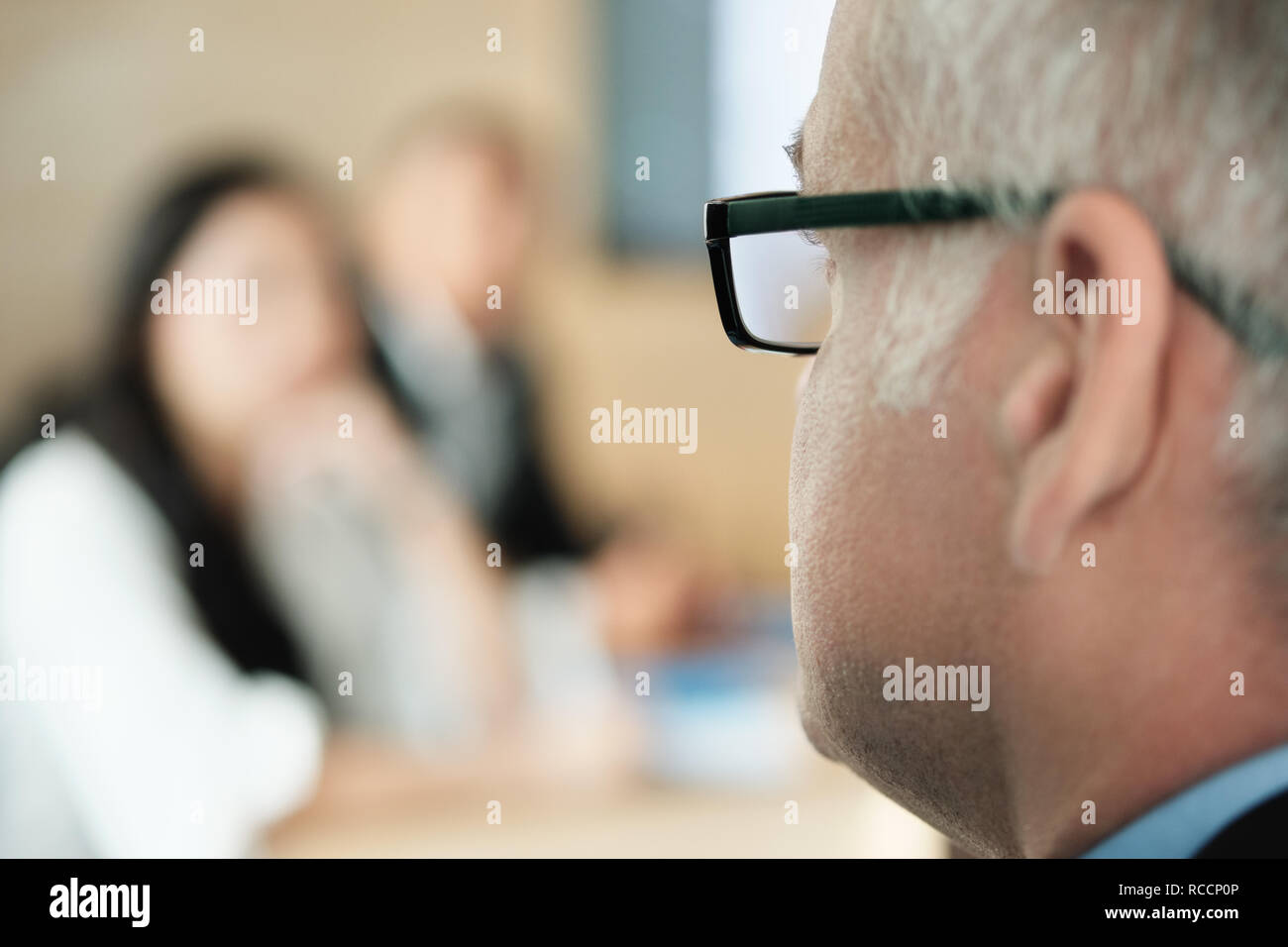 Businessman Talking To Colleagues and Clients In Office Meeting Room ...