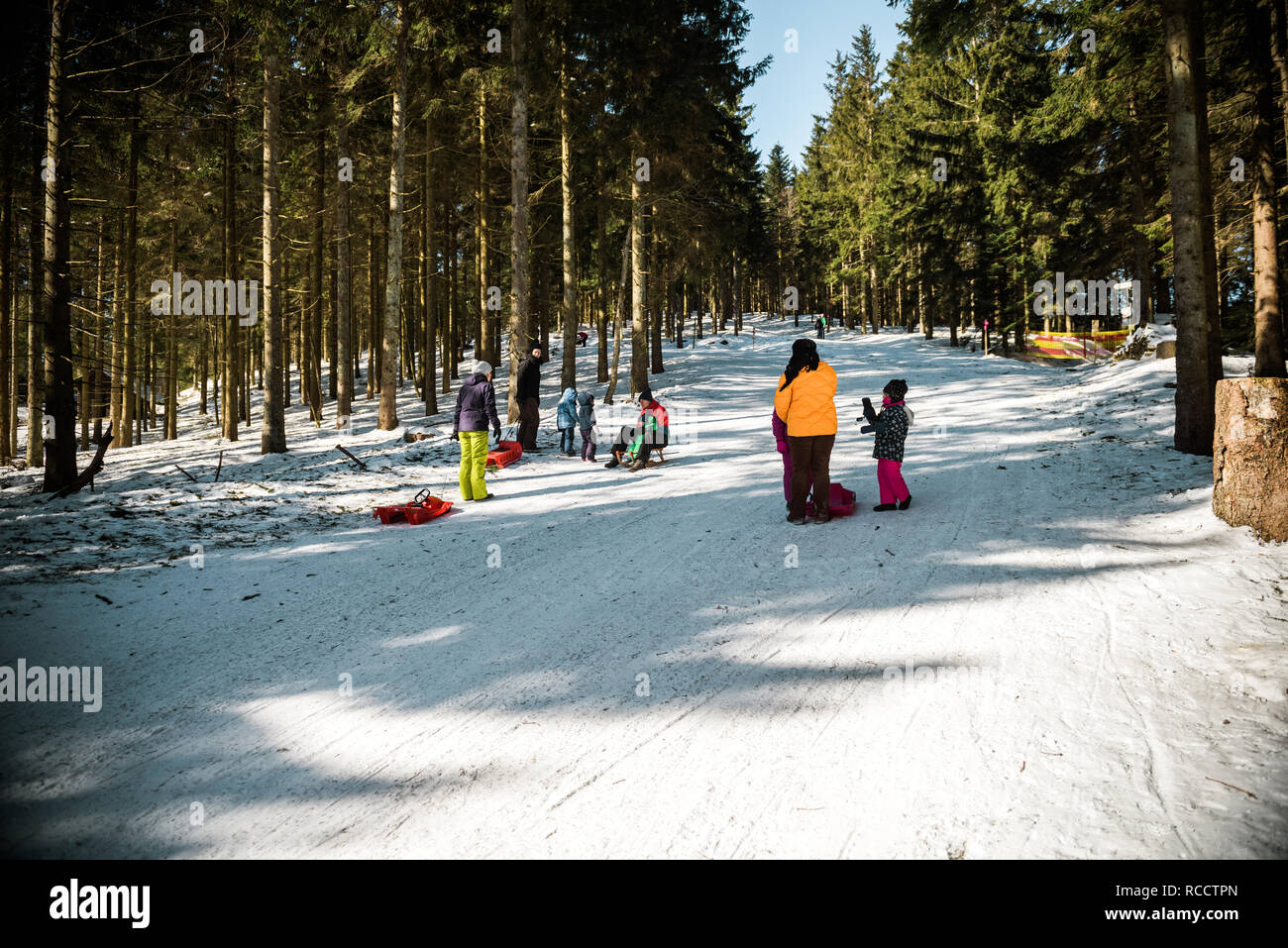Kids sledging on the slope hi-res stock photography and images - Alamy