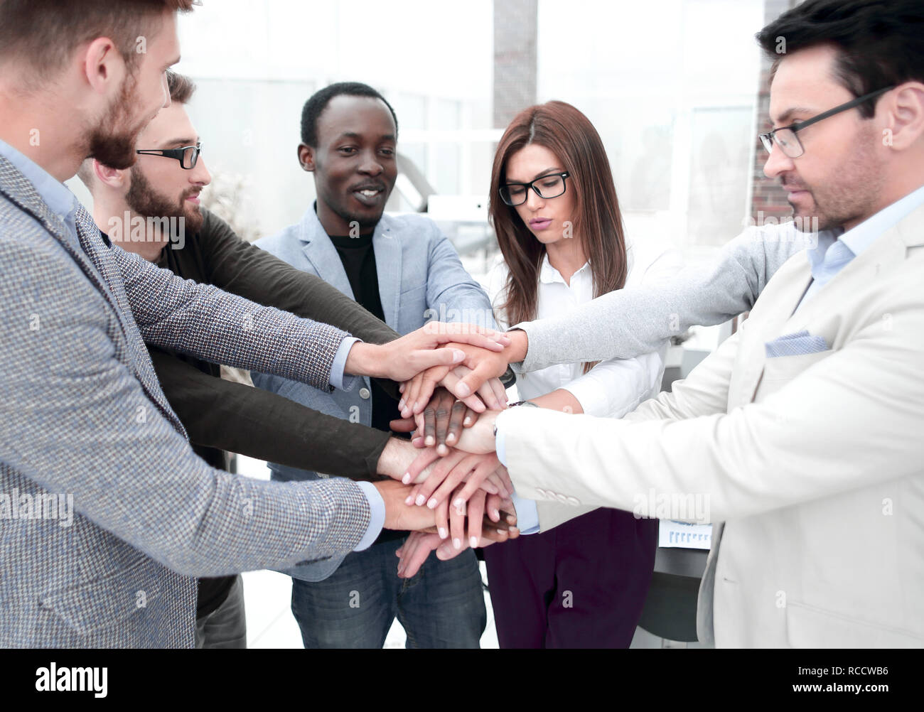Stack of hands overhead view hi-res stock photography and images - Alamy