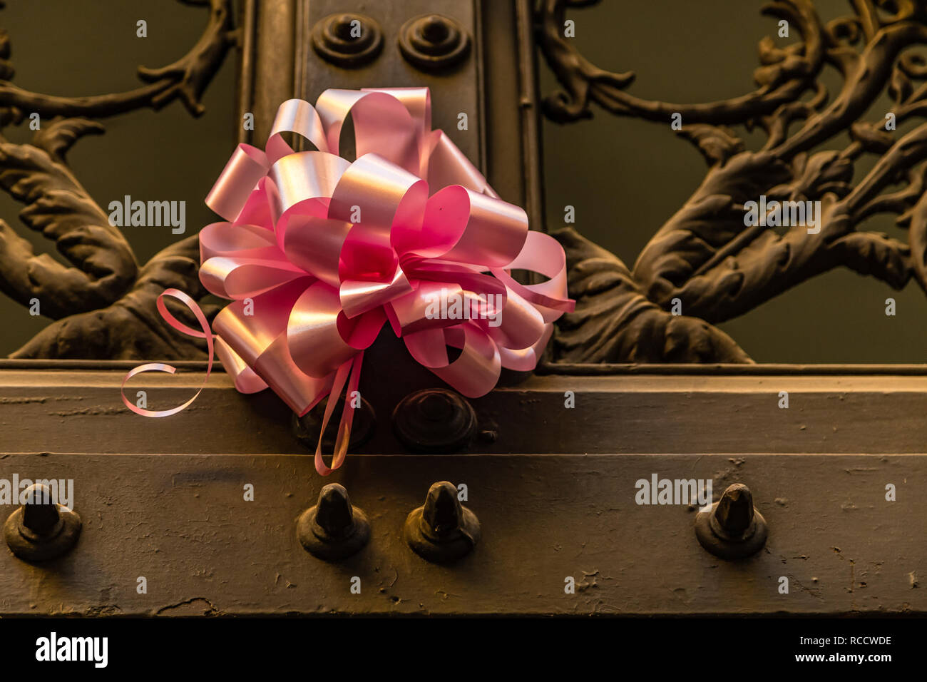 pink ribbon on rusty iron door Stock Photo - Alamy