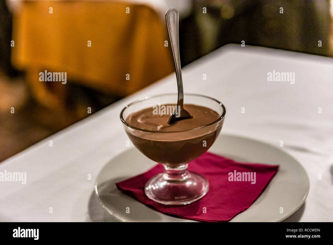 spoon deep in chocolate mousse in Italian restaurant Stock Photo - Alamy