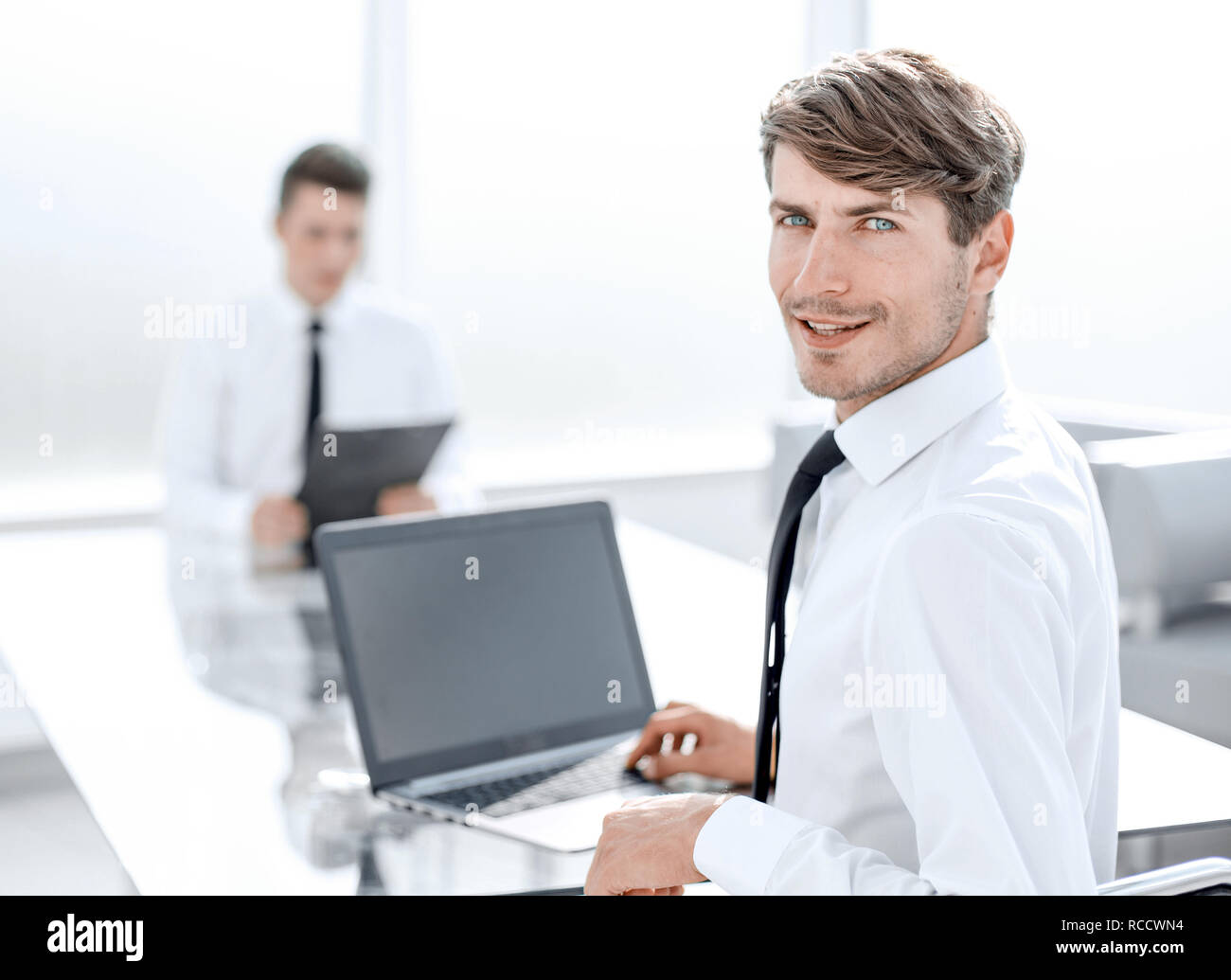 rear view.successful businessman sitting at the office Desk Stock Photo ...