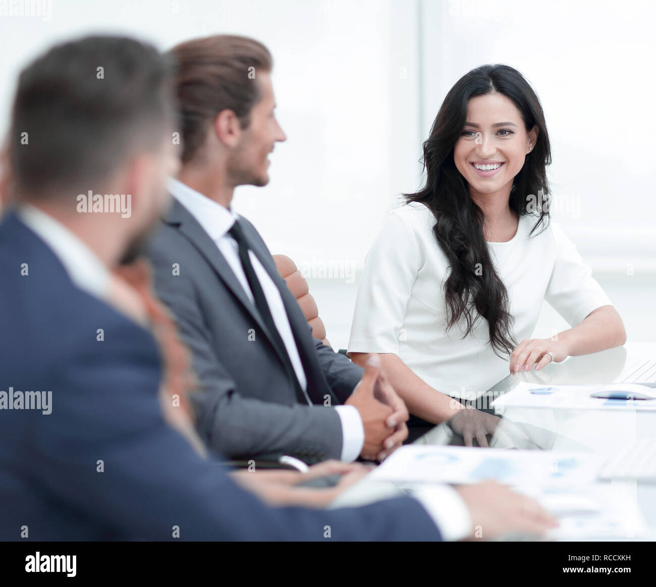 business people communicate at work their Desk Stock Photo - Alamy