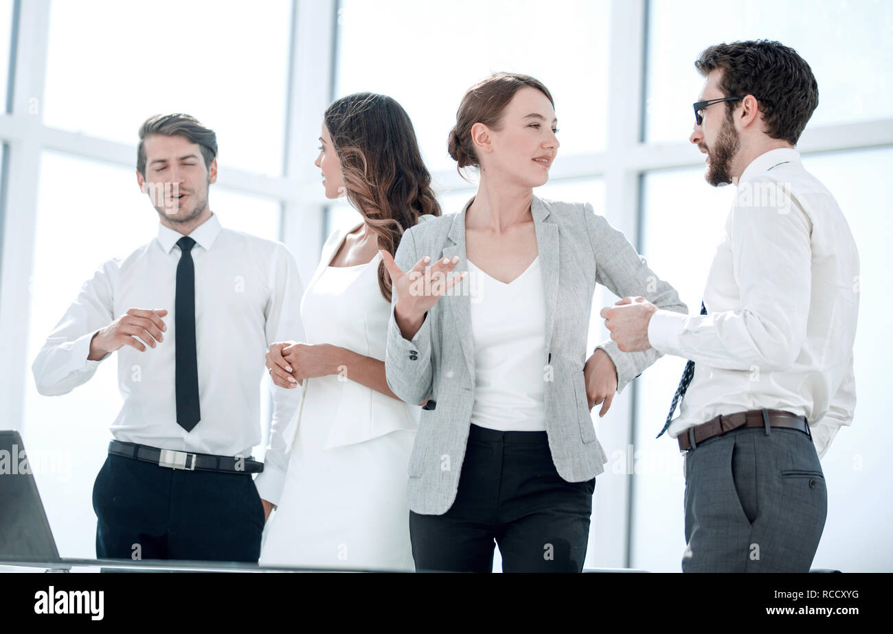 young employees talk in the office Stock Photo - Alamy