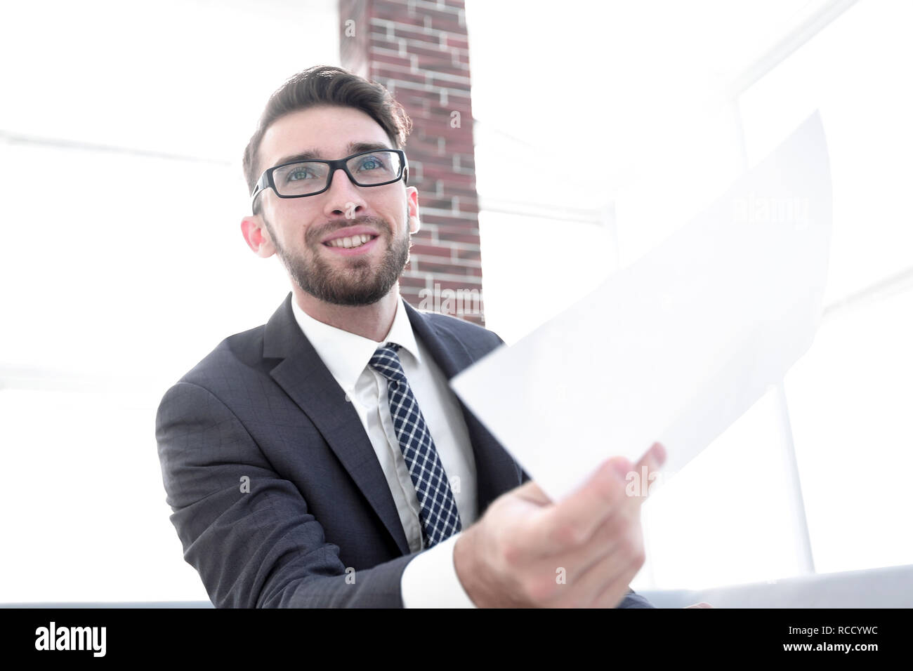 Image of business man holding paper Stock Photo - Alamy
