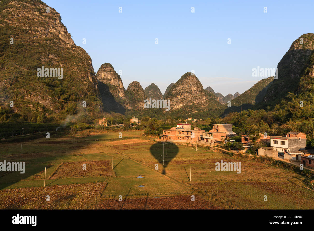 Aerial view of the Karst mountains, rice fields, and houses, in china ...