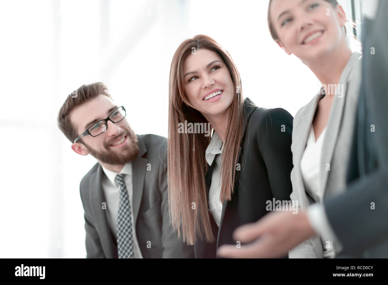 close up.successful employees listen to their boss Stock Photo - Alamy
