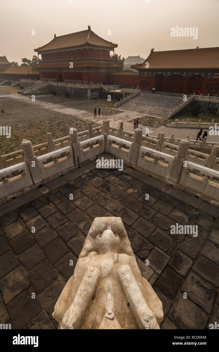 Stone dragon head faces red tiled roof buildings in forbidden city ...