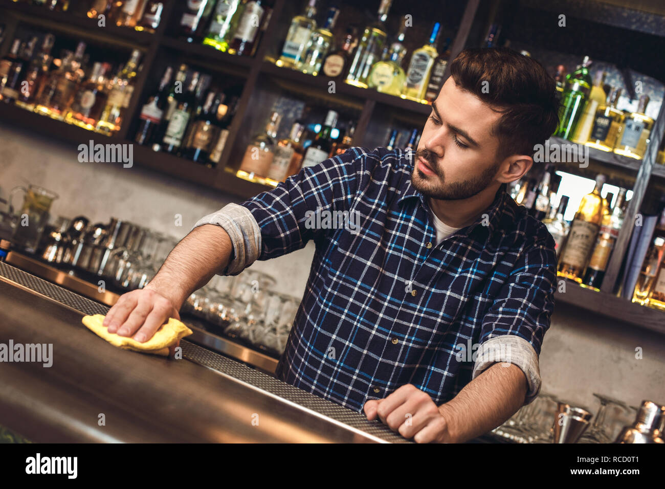Caucasian male bartender wiping bar hi-res stock photography and images ...