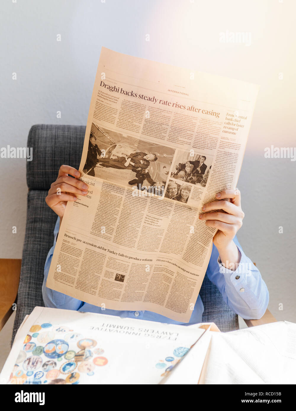 Paris, France - Mar 16, 2018: Young business woman reading Financial ...