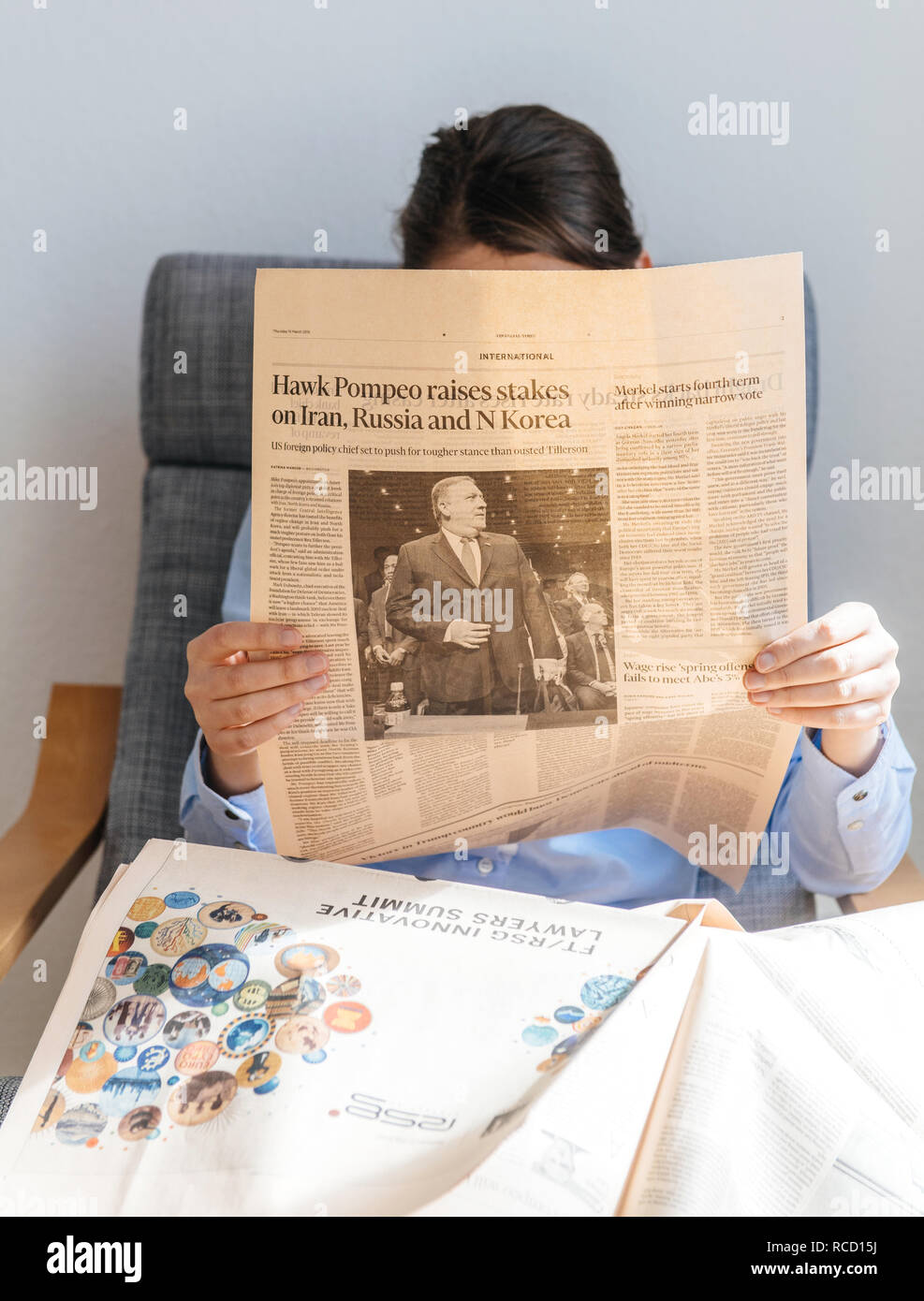 Woman reading financial times hi-res stock photography and images - Alamy