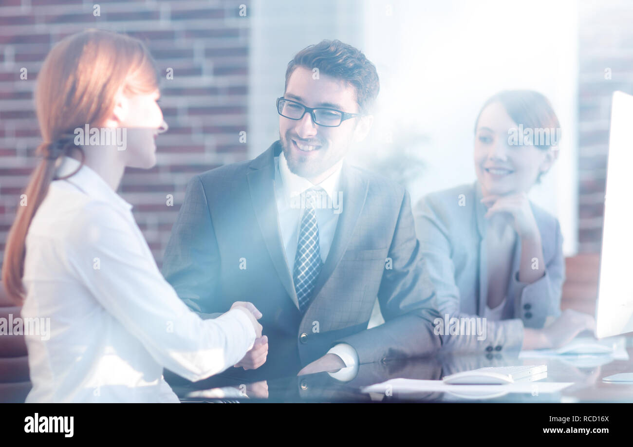 friendly handshake between colleagues in the office Stock Photo - Alamy