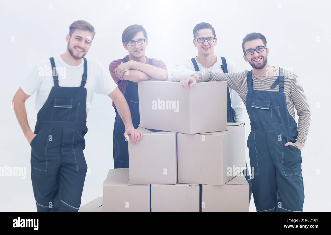 Men holding pile of carton boxes isolated on white background Stock ...