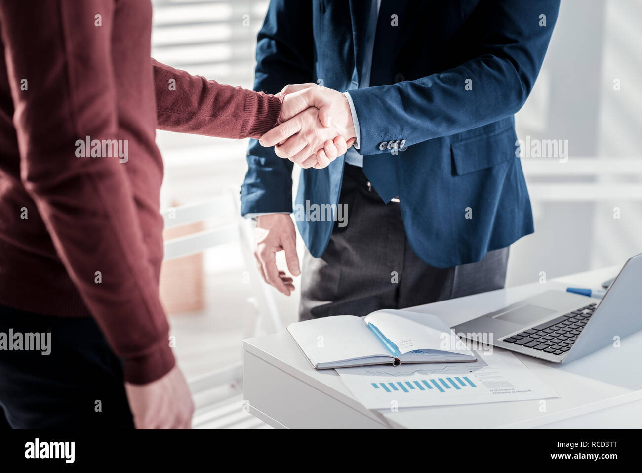 Attractive male hands shaking Stock Photo - Alamy
