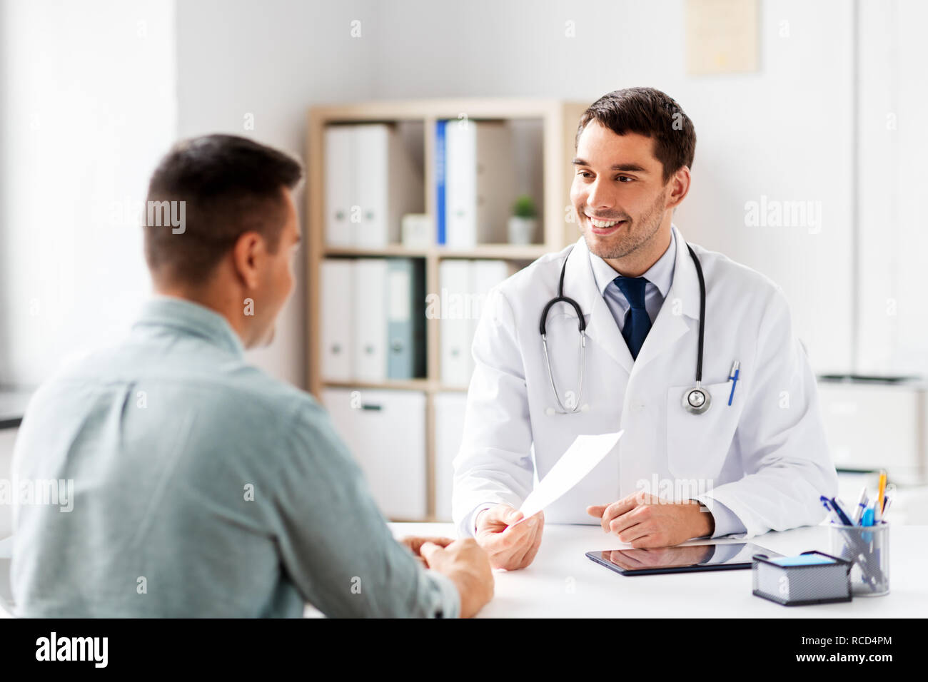 doctor giving prescription to patient at hospital Stock Photo - Alamy