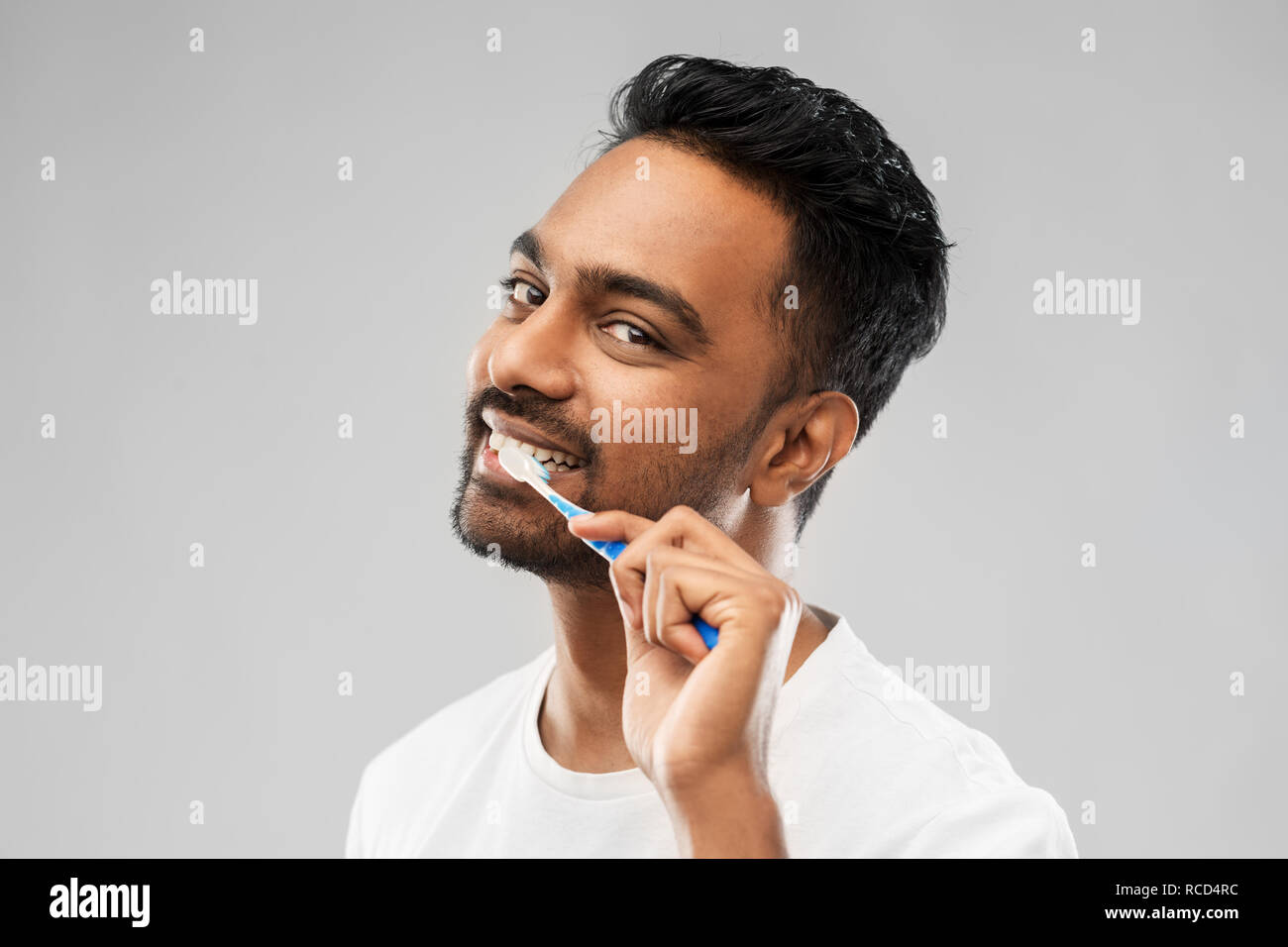 indian man with toothbrush cleaning teeth Stock Photo - Alamy