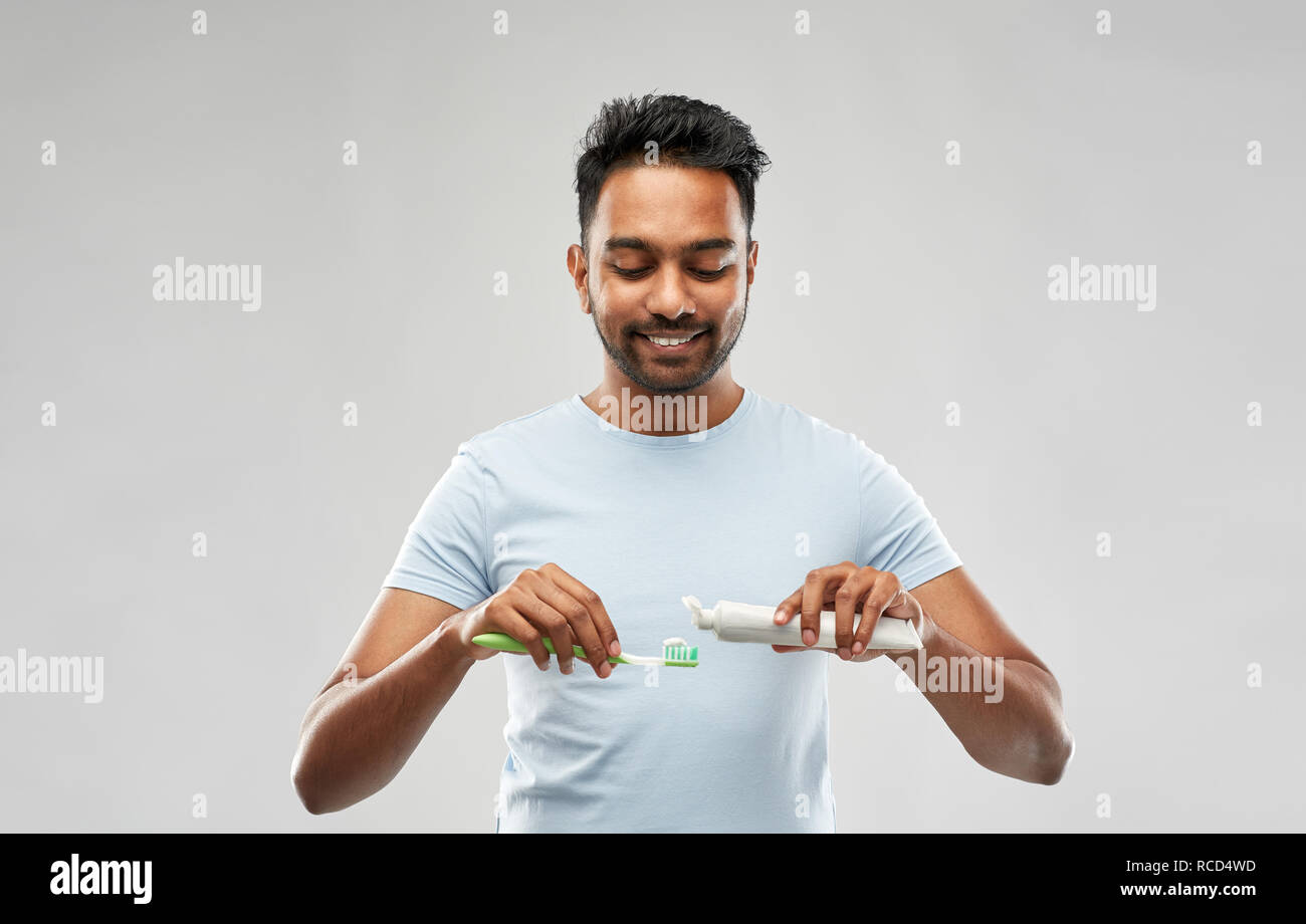 indian man with toothbrush and toothpaste Stock Photo - Alamy