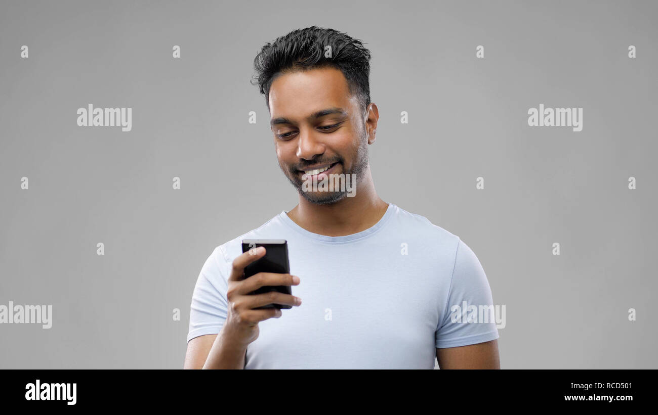 happy indian man using smartphone Stock Photo - Alamy