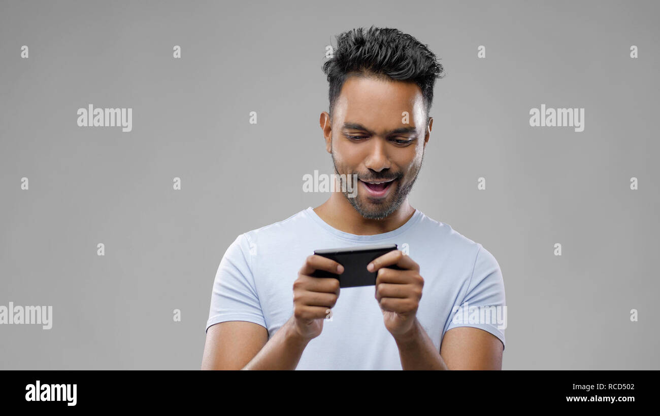 Male gamer playing mobile hi-res stock photography and images - Alamy
