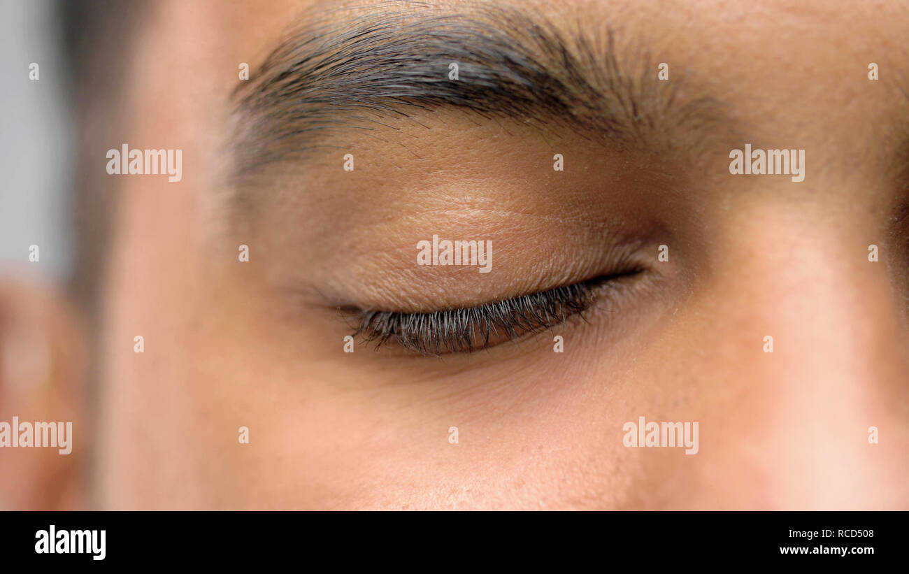 close up of closed male eye Stock Photo - Alamy