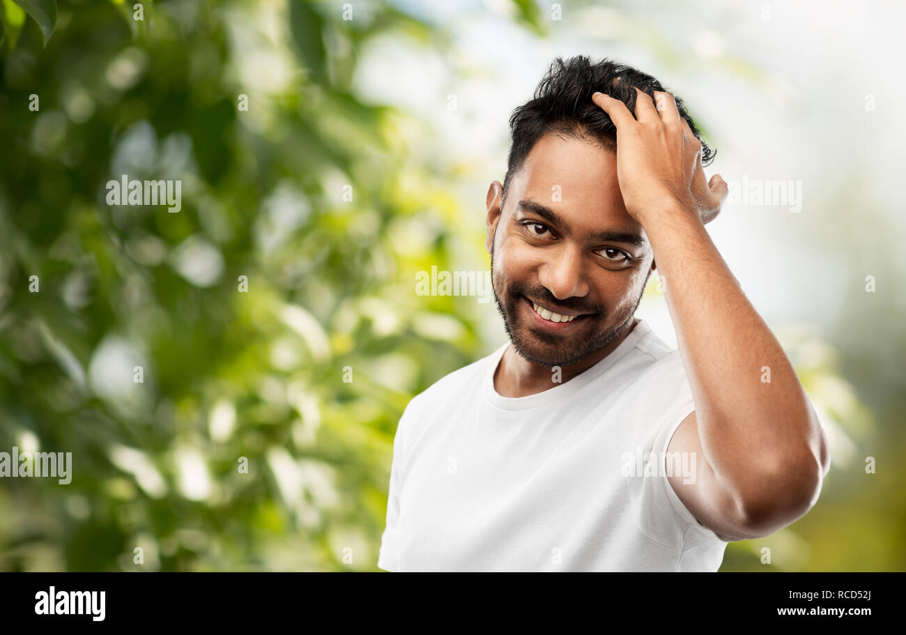 indian man touching his hair Stock Photo - Alamy