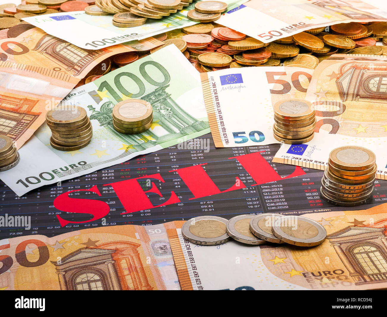 Image of money and the word sell on investment paper Stock Photo - Alamy