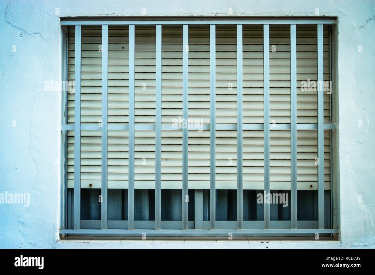 Very plain and modern aluminum grill covering closed window and ...