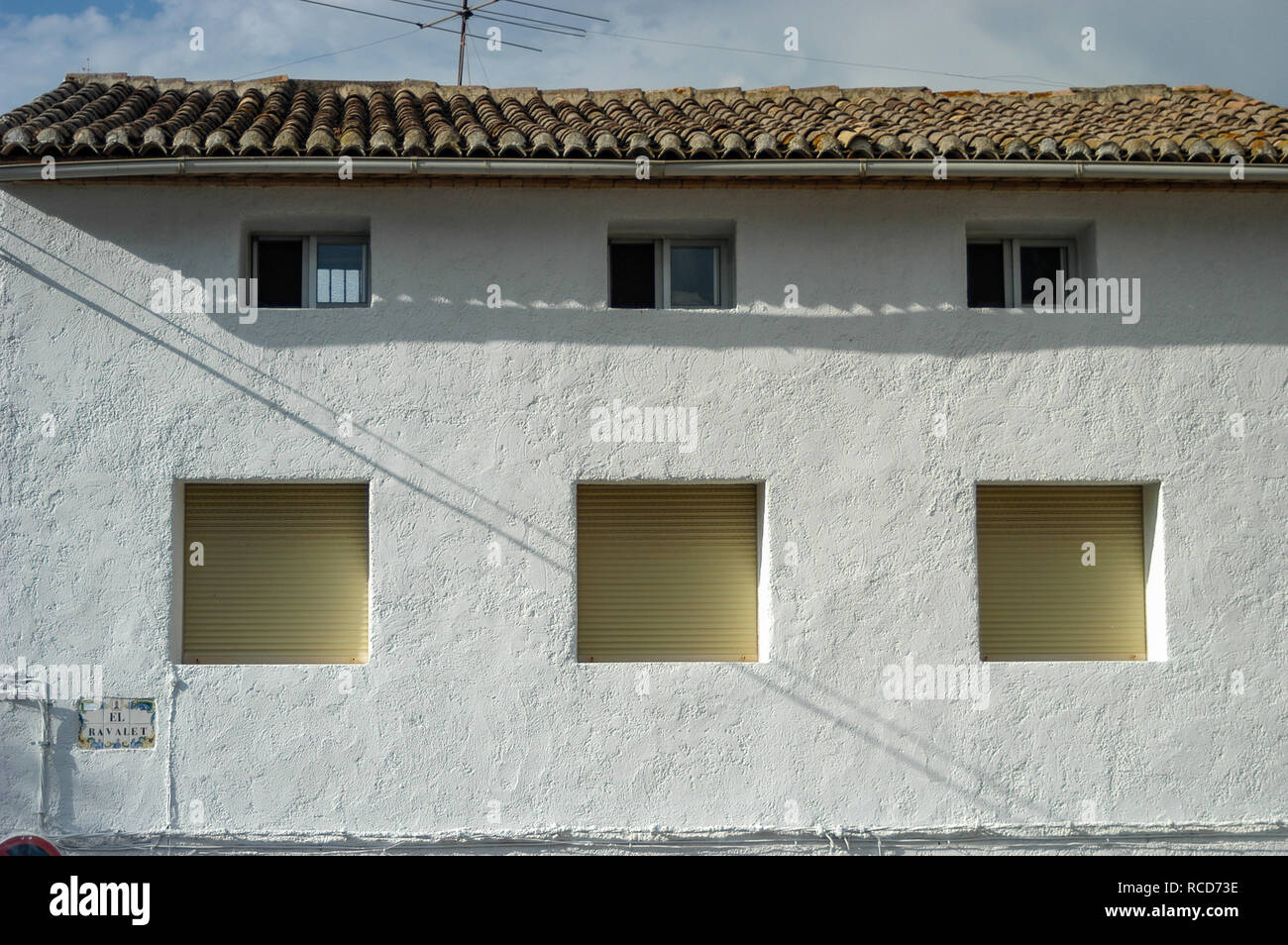 3 small windows and 3 larger shuttered windows all in 2 rows set a ...