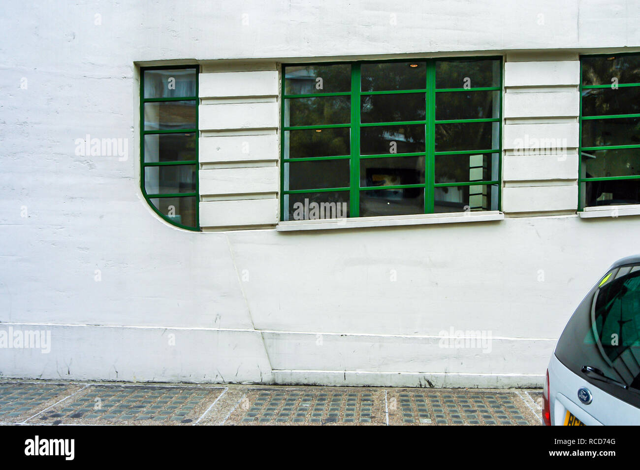 Windows set in an oblique angle fitted Art Deco building Stock Photo ...