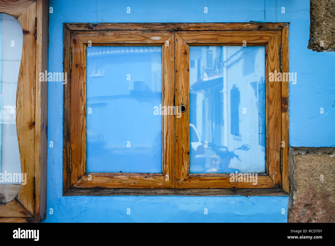 False double window frame with Glass mounted on a blue rendered wall ...