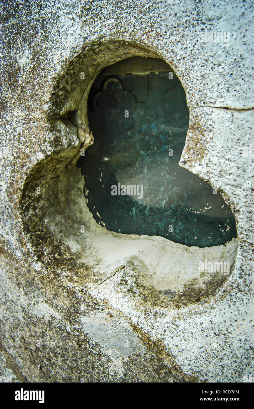 Different shaped window cut from stone in a house wall Stock Photo - Alamy