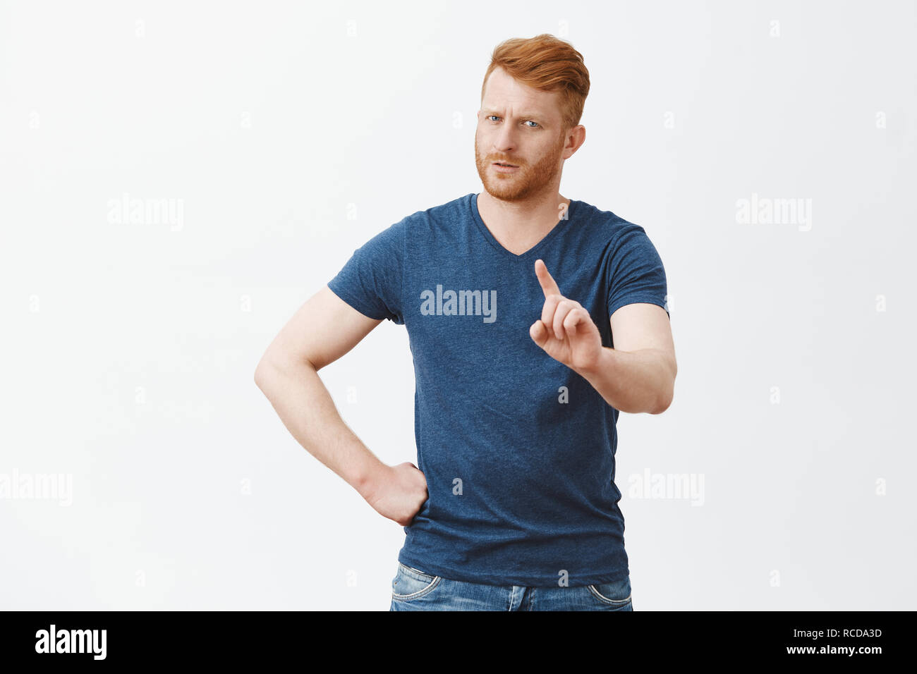 Hold on, I forbid you. Strict serious-looking young dad with ginger ...