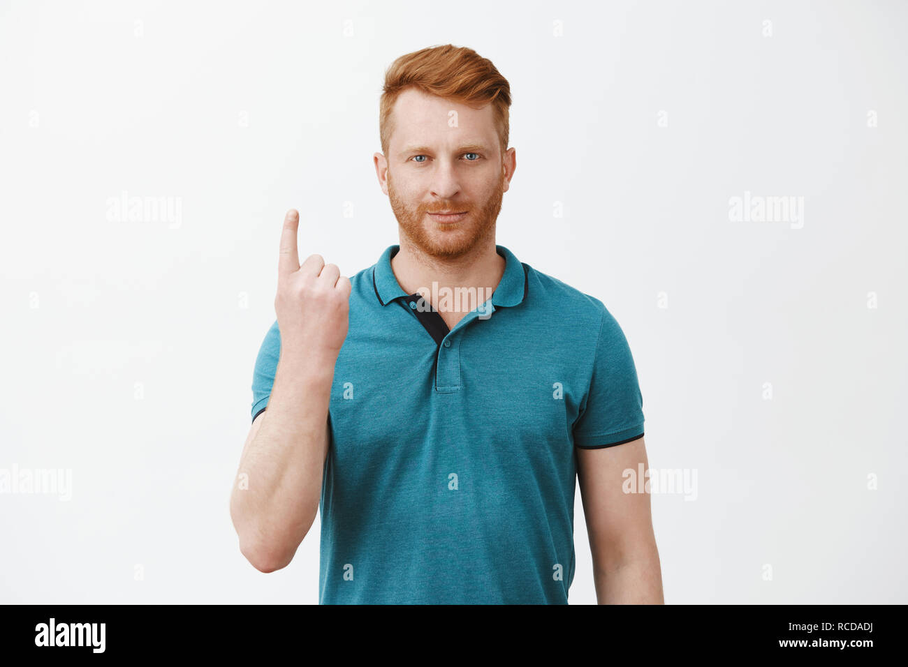 Man feeling like number one. Portrait of confident handsome redhead ...