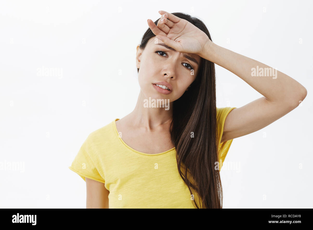 Exhausted gloomy drained attractive woman with lond beautiful dark hair ...