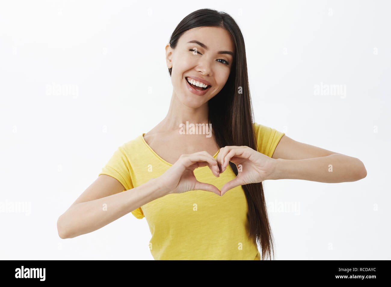 Waist-up shot of cute caring and happy girlfriend with lond dark hair ...