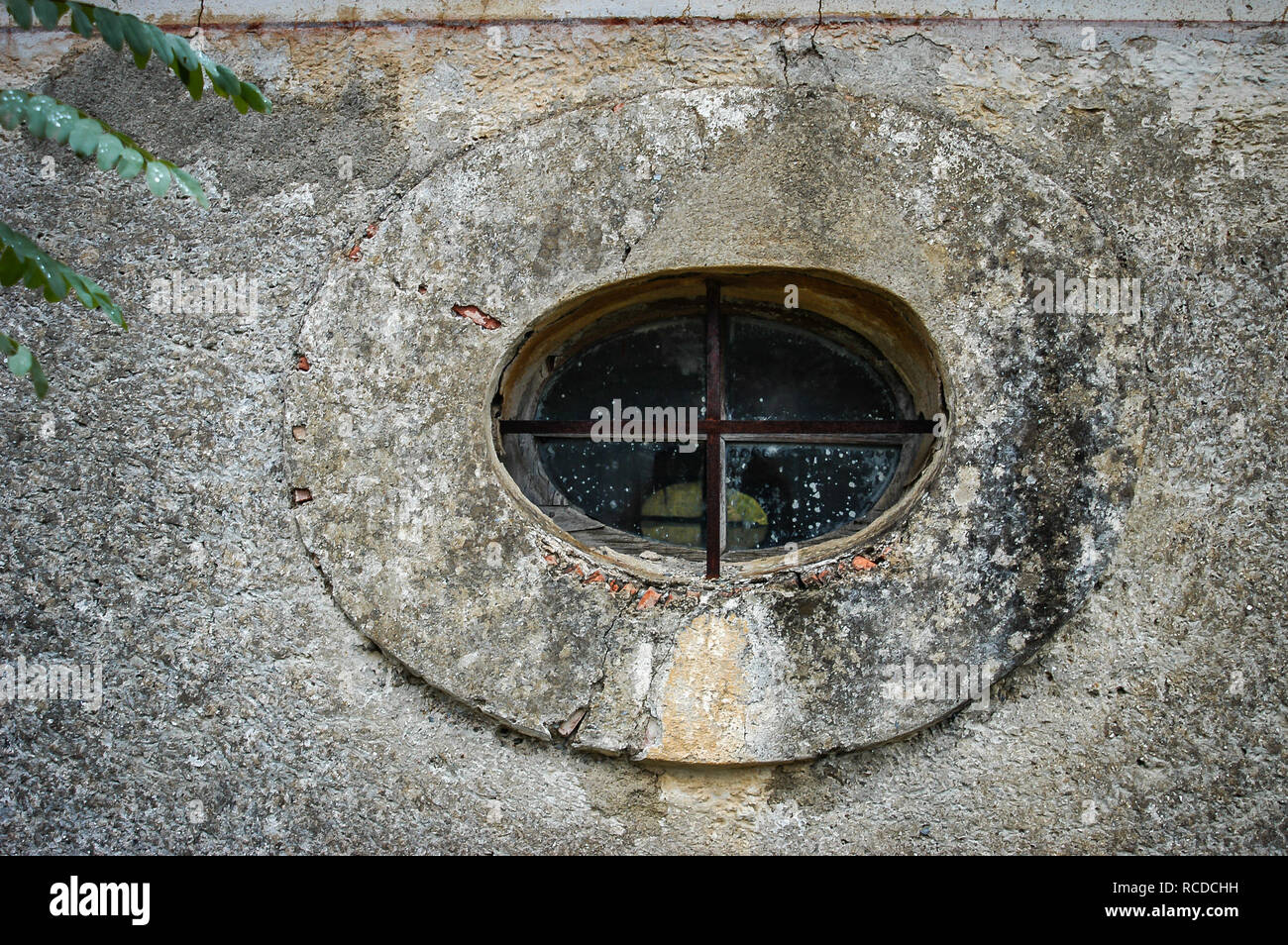 Different shaped window cut from stone in a house wall Stock Photo - Alamy