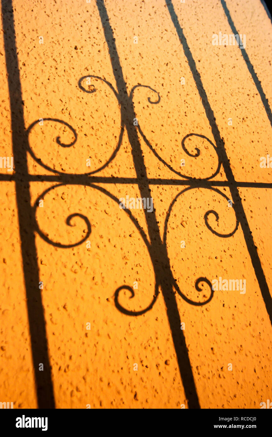 Security Bar Shadows cast on a wall from a window Stock Photo - Alamy