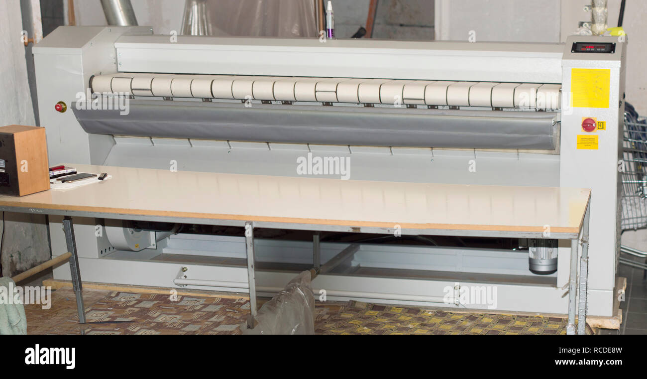 Laundry press machine hi-res stock photography and images - Alamy