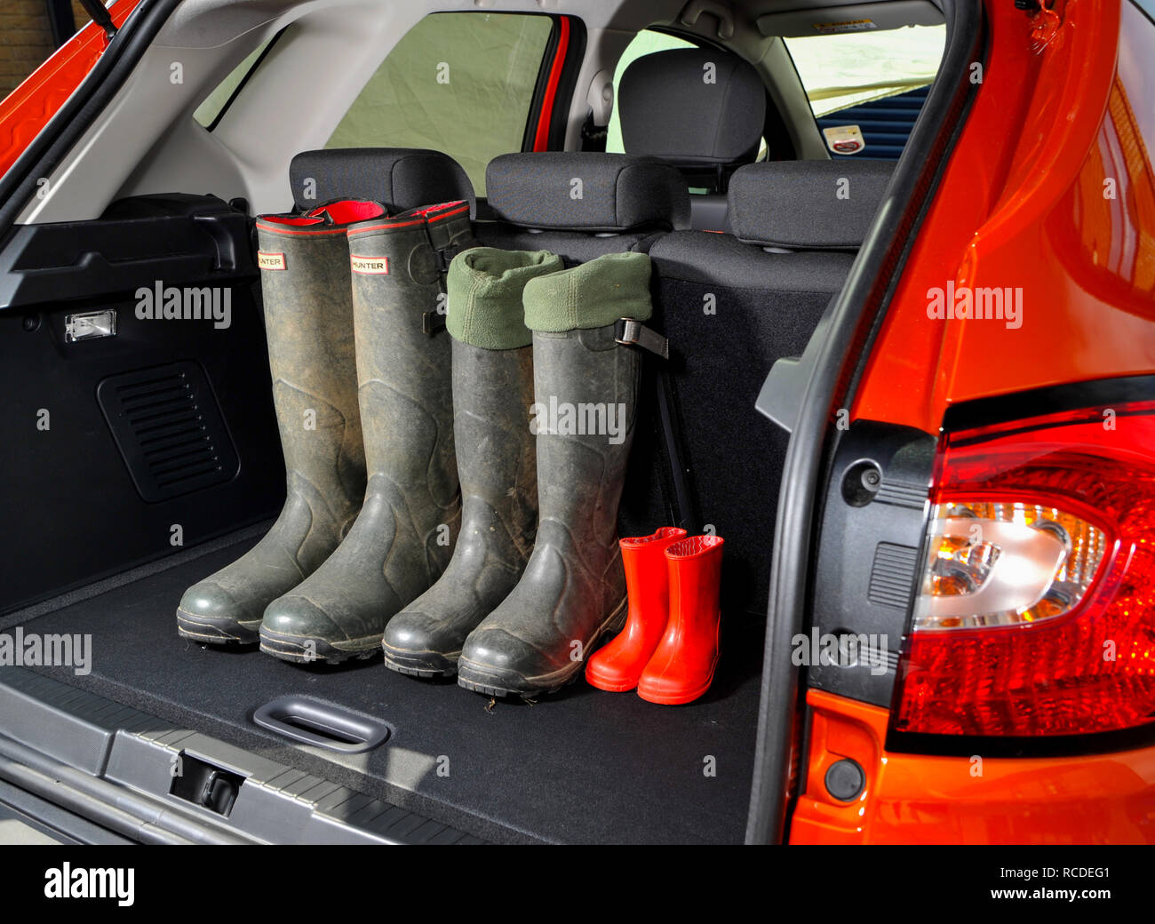 Family's welly boots in the boot of a 2013 Renault Captur French small ...