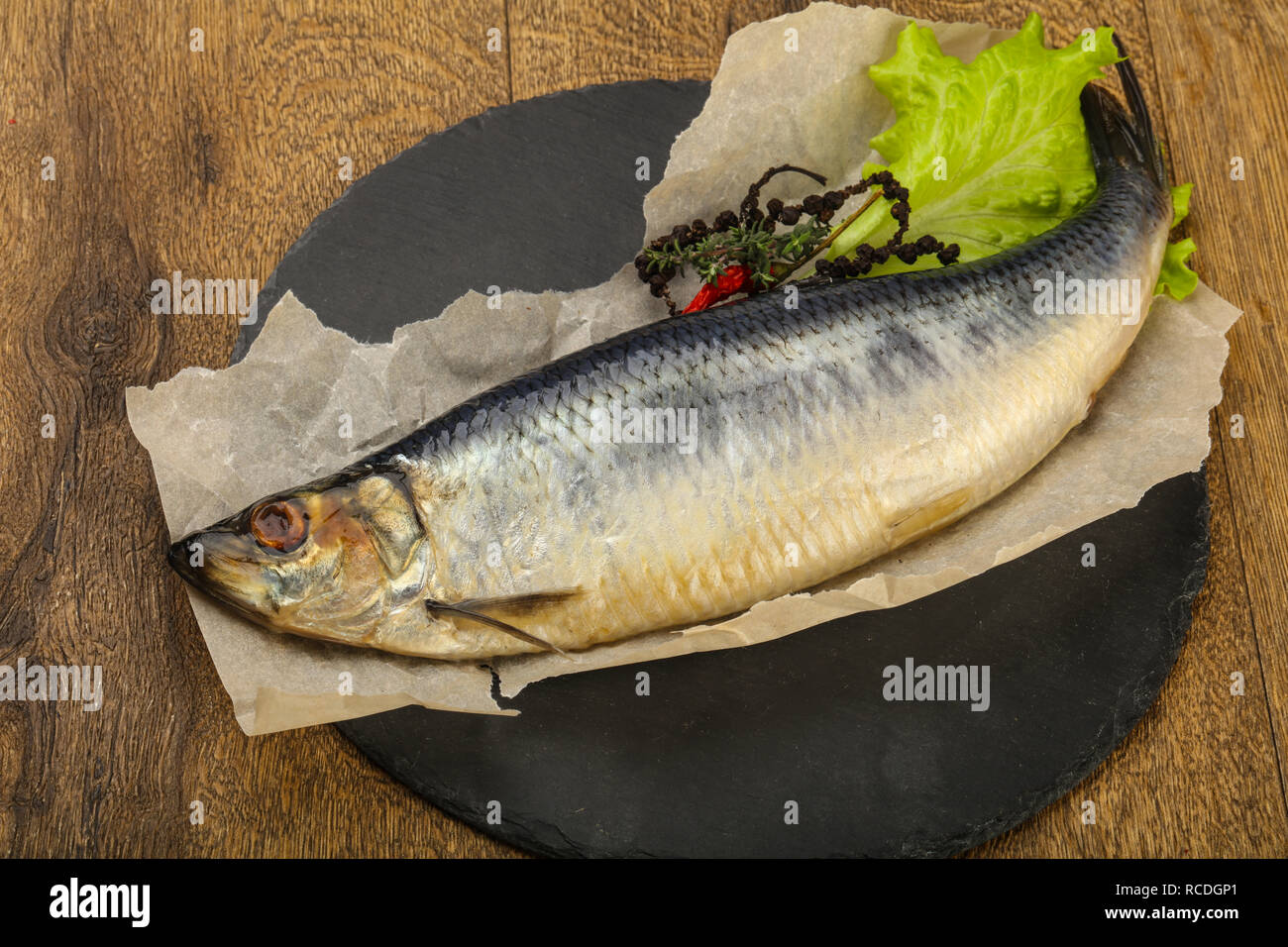Salted Herring fish with pepper and spices Stock Photo - Alamy