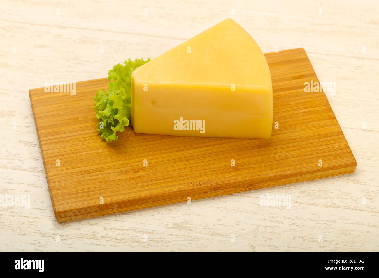 Parmesan cheese triangle Stock Photo - Alamy
