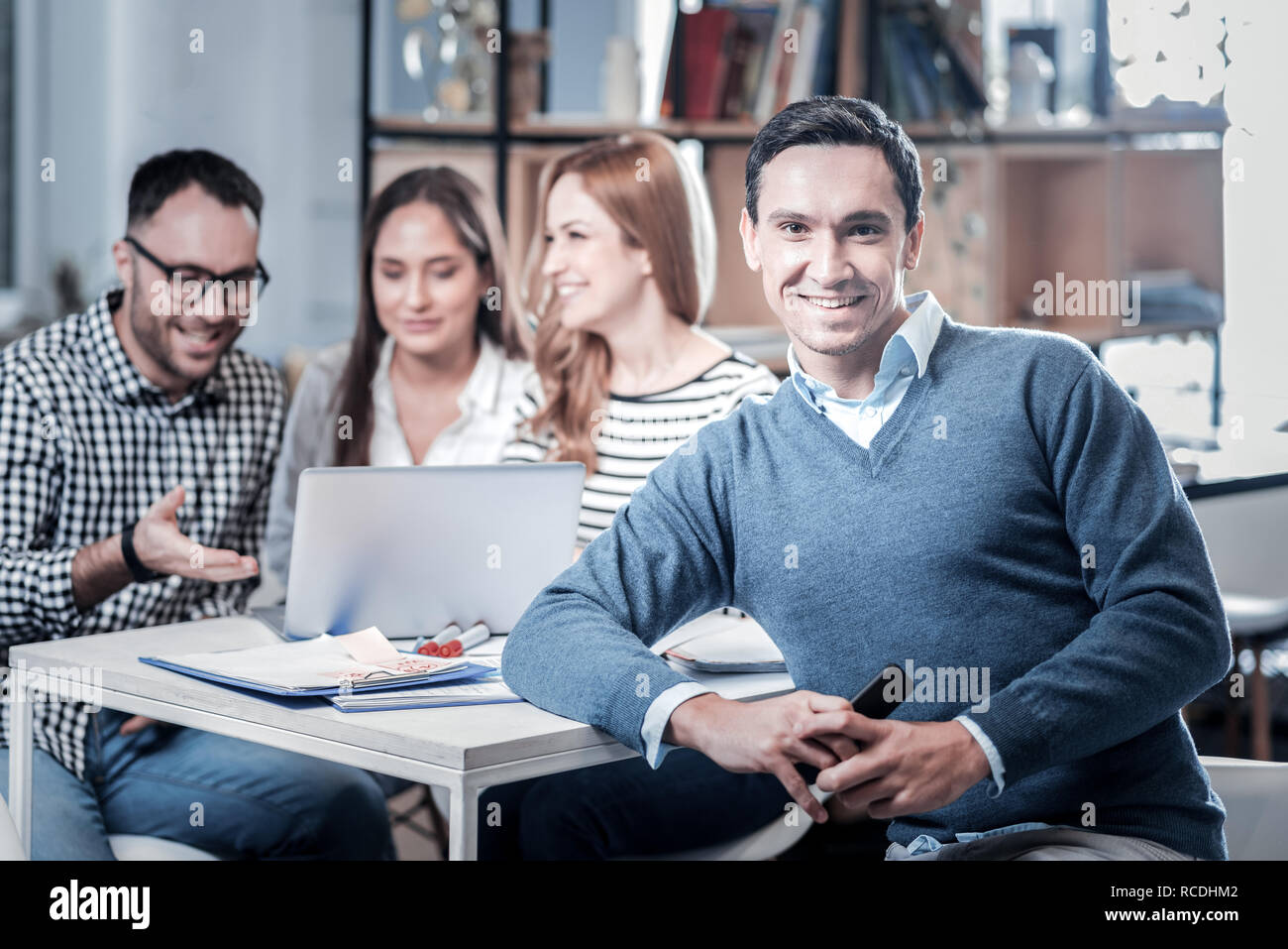 Alert man sitting in the office Stock Photo - Alamy