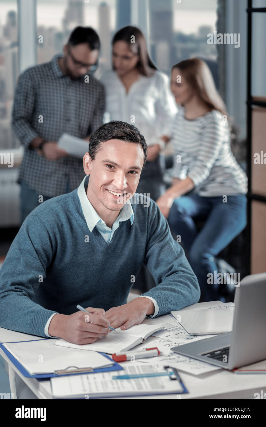 Joyful man taking some notes Stock Photo - Alamy
