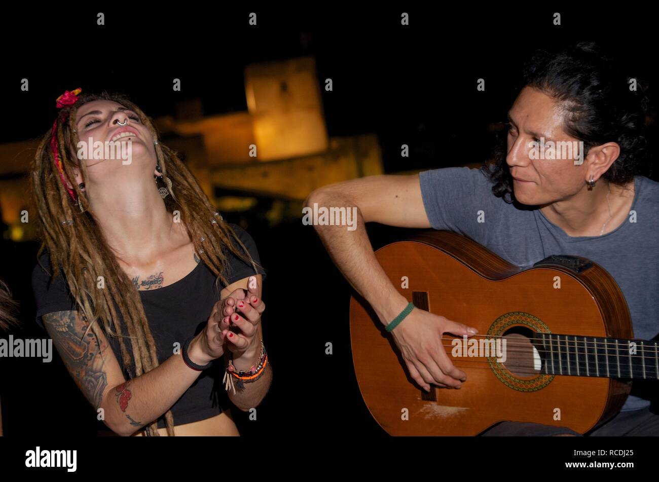 Flamenco musicians performing in Granada with Alhambra in the ...