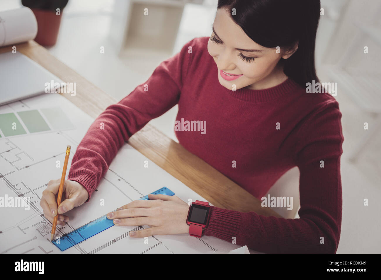 Smart nice woman doing a drawing Stock Photo - Alamy