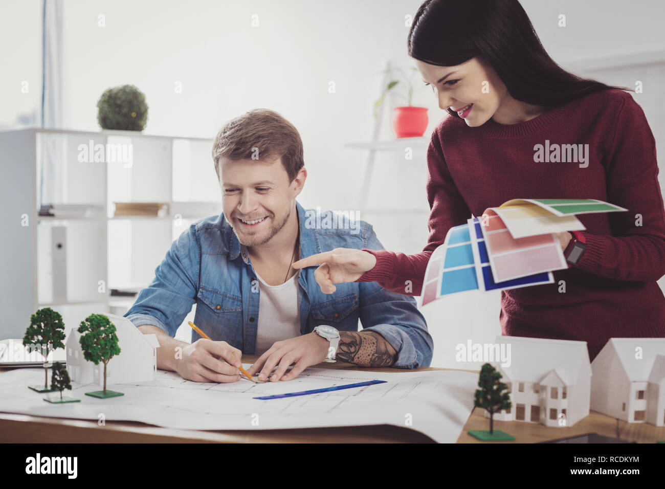 Happy positive man doing a drawing Stock Photo - Alamy