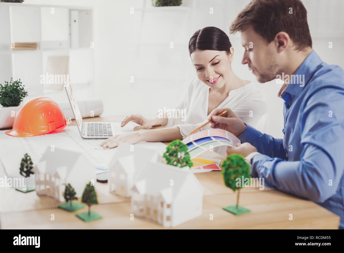 Positive smart people working in team Stock Photo - Alamy